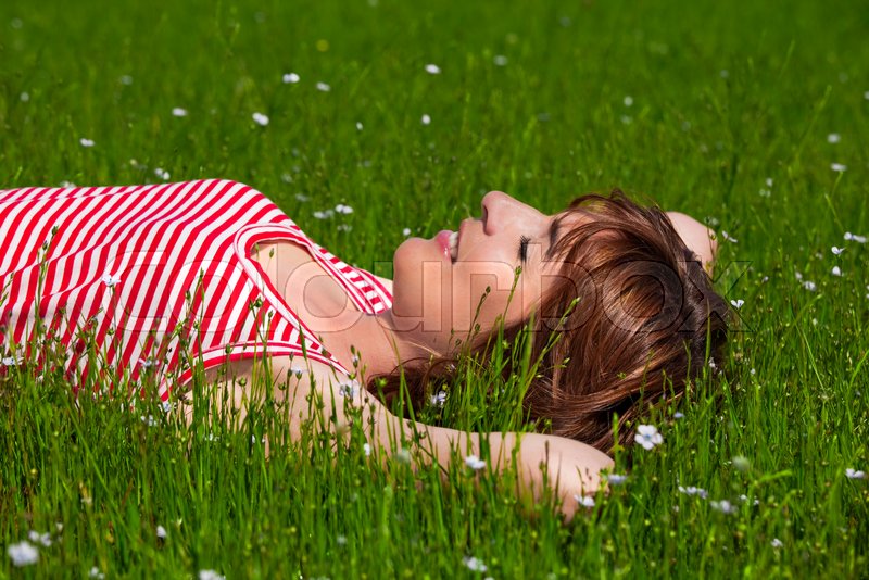 Young woman relaxing on a beautiful ... | Stock image | Colourbox