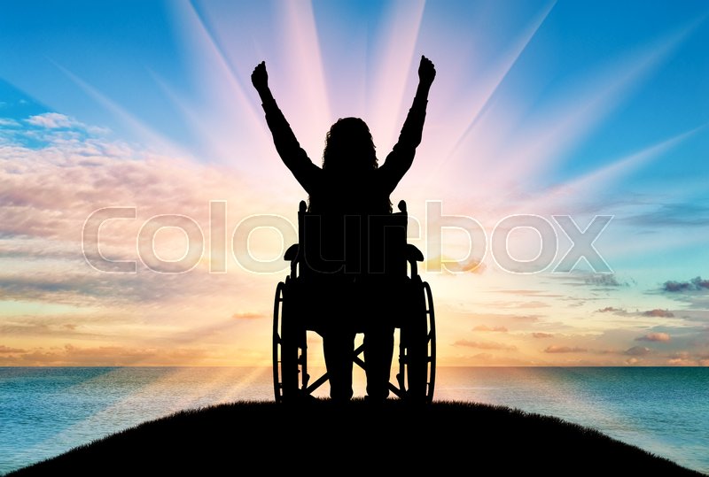 Happy disabled woman in a wheelchair on ... | Stock image | Colourbox