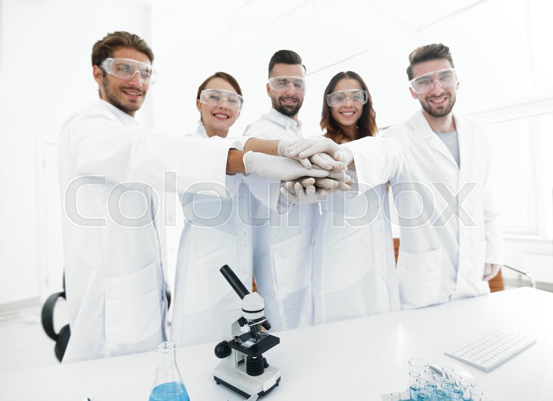 Successful team of young scientists ... | Stock image | Colourbox