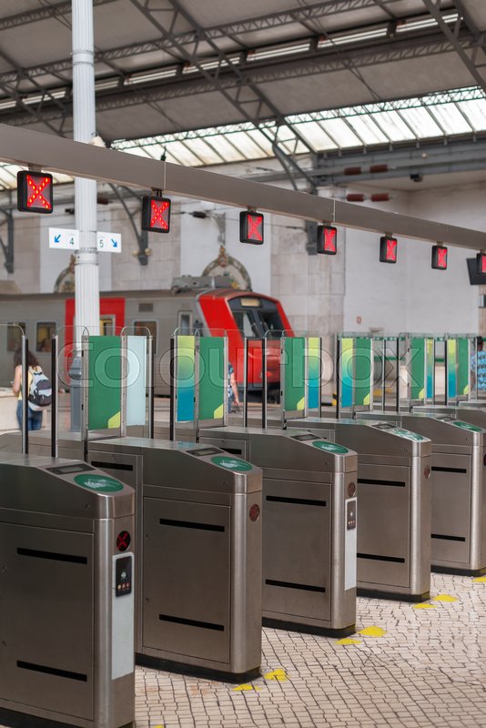 Electronic turnstiles in train station ... | Stock image | Colourbox