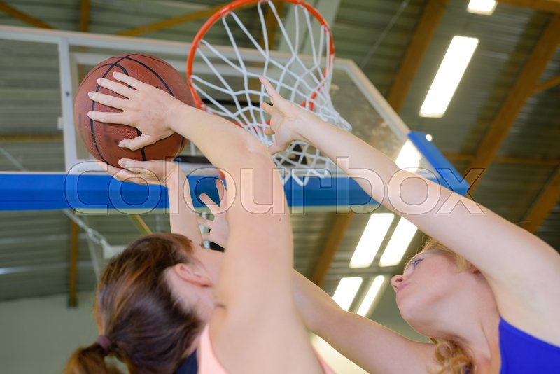 Playing indoor basketball | Stock image | Colourbox