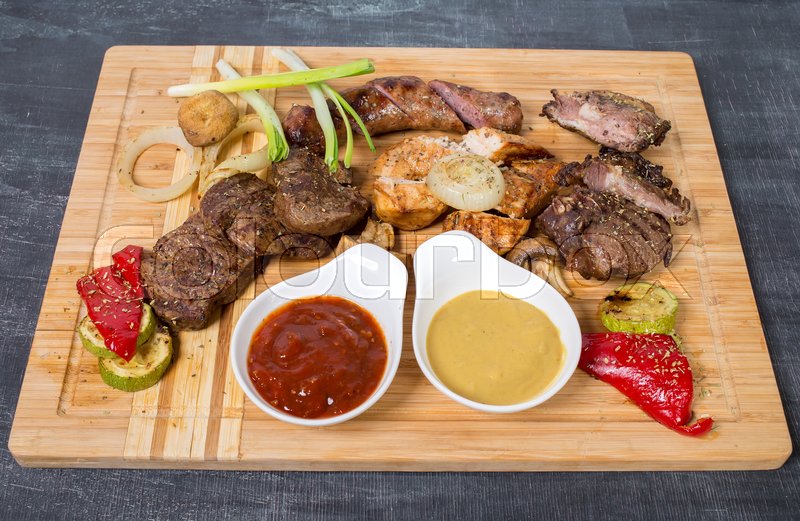 Mixed grilled meats platter with ... | Stock image | Colourbox
