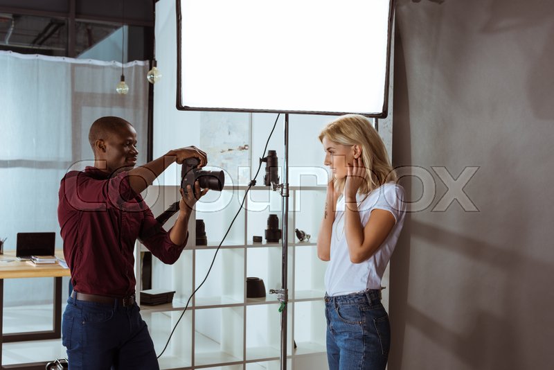African american photographer taking ... | Stock image | Colourbox
