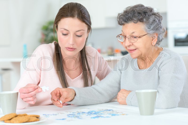 Woman taking care of her grandmother | Stock image | Colourbox