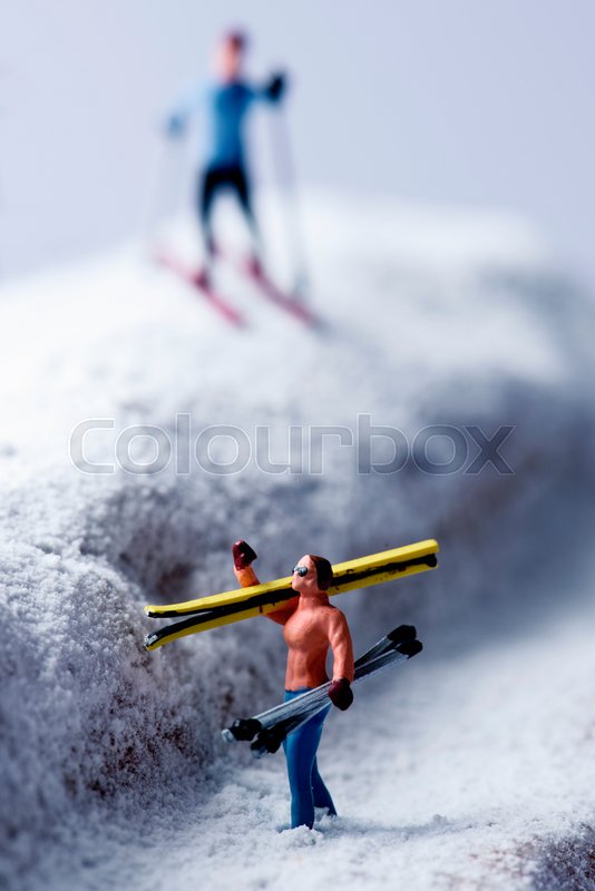 Two miniature skiers in a snowy ... | Stock image | Colourbox