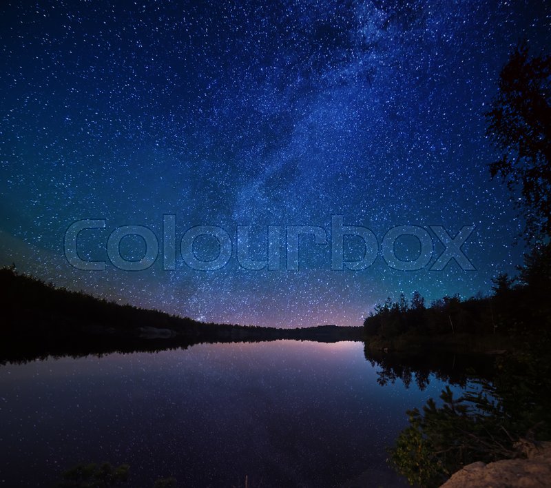 Lake at night with amazing starry sky ... | Stock image | Colourbox