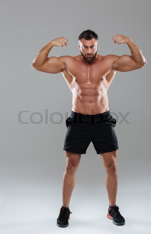 Full length portrait of a muscular ... | Stock image | Colourbox