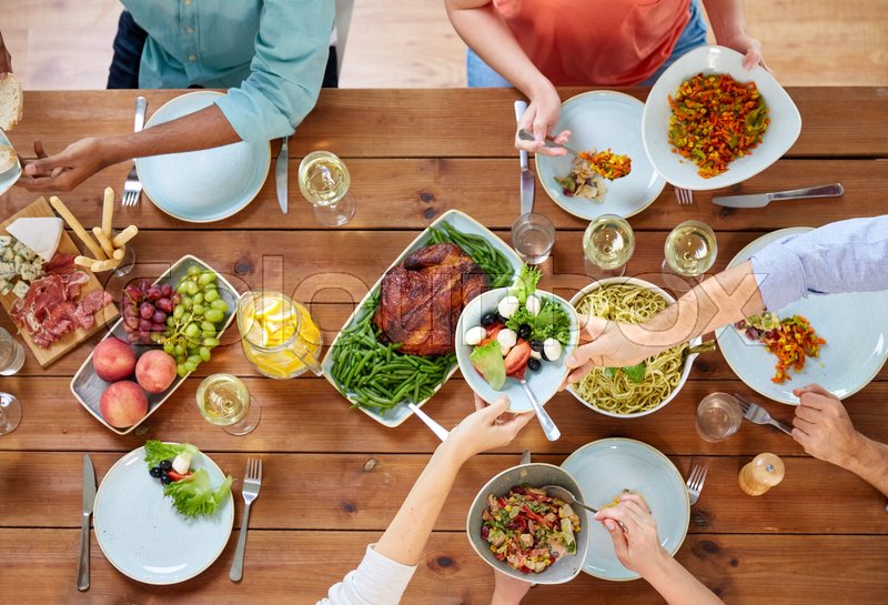 People Eating Food At A Table