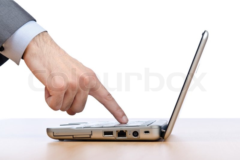 Hand pressing buttons on laptop | Stock image | Colourbox