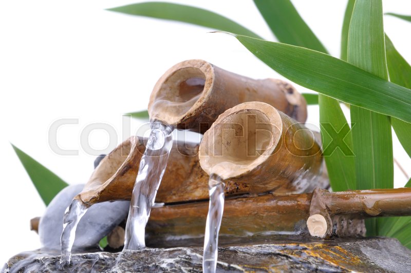 Water flowing from a little bamboo ... | Stock image | Colourbox