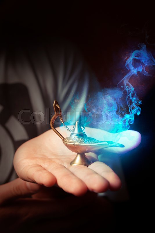 Young man's hand holding a magical, ... | Stock image | Colourbox