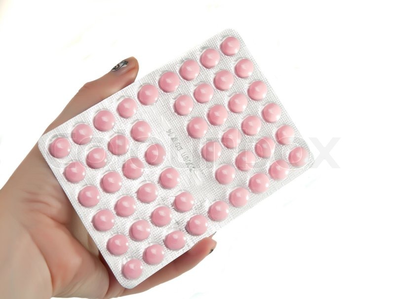 Pack of pink tablets on a white ... | Stock image | Colourbox