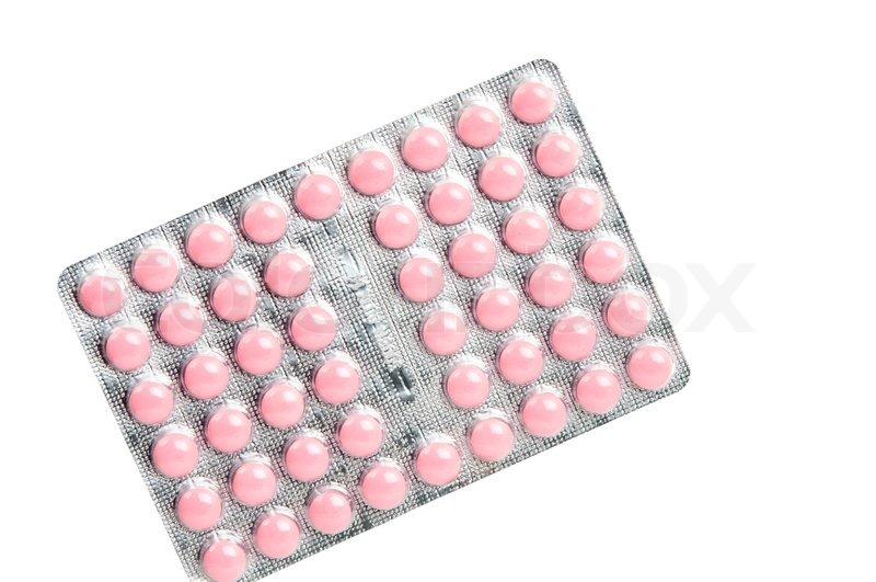 Pack of pink tablets on a white ... | Stock image | Colourbox