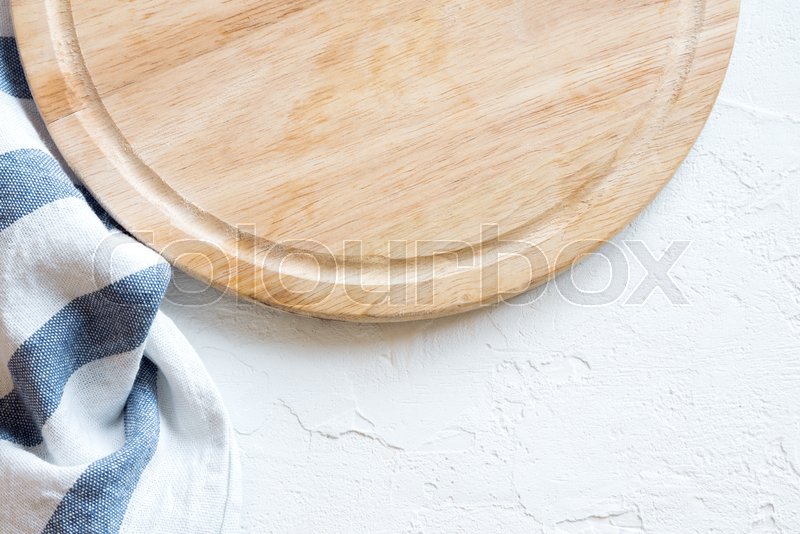 Empty wooden platter with napkin on ... | Stock image | Colourbox