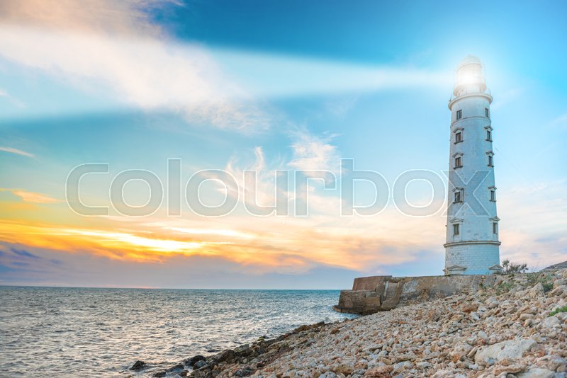 Lighthouse searchlight beam through sea ... | Stock image | Colourbox