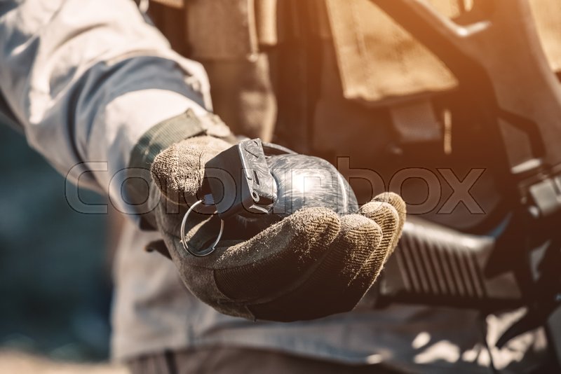 The soldier holds in his hand a ... | Stock image | Colourbox