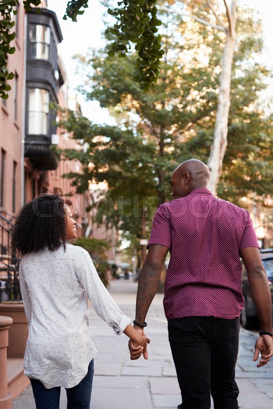 Rear View Of Couple Walking Along Urban ... | Stock image | Colourbox