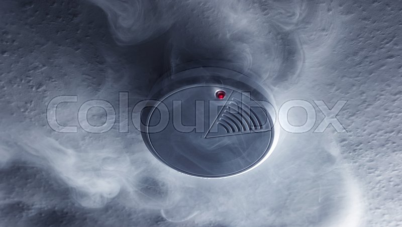 Smoke detector mounted on roof in house ... | Stock image | Colourbox
