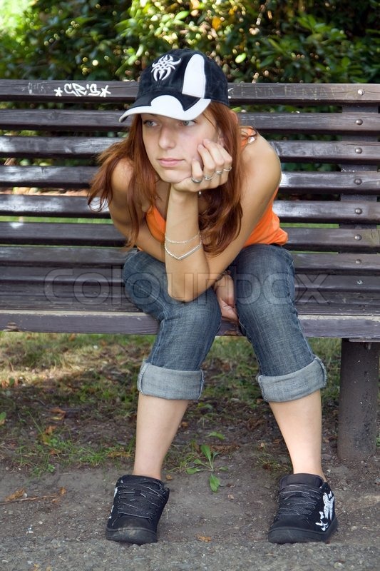 Girl sitting on bench | Stock image | Colourbox