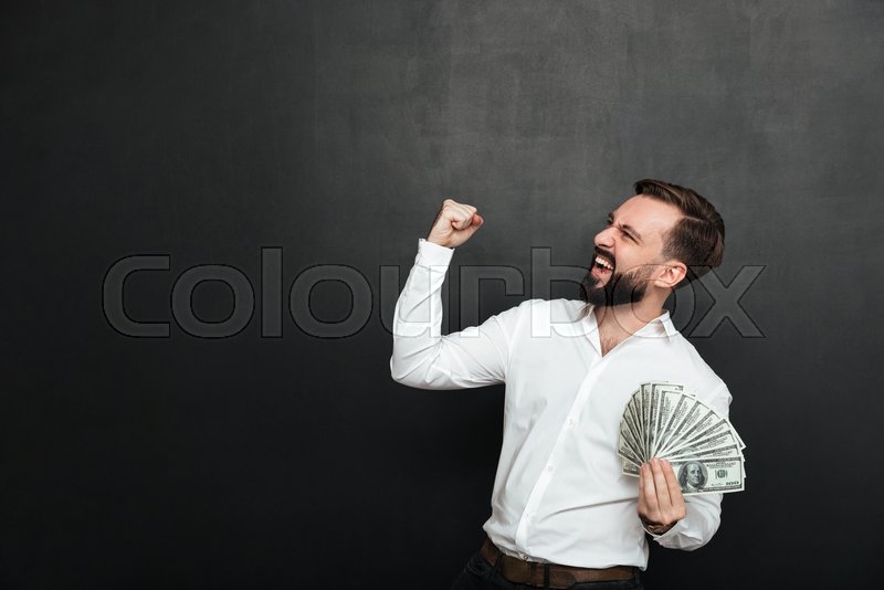 Portrait of successful guy in white ... | Stock image | Colourbox