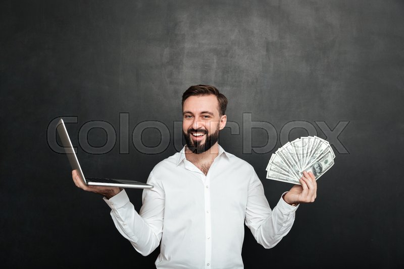 Portrait of cheerful rich man in white ... | Stock image | Colourbox