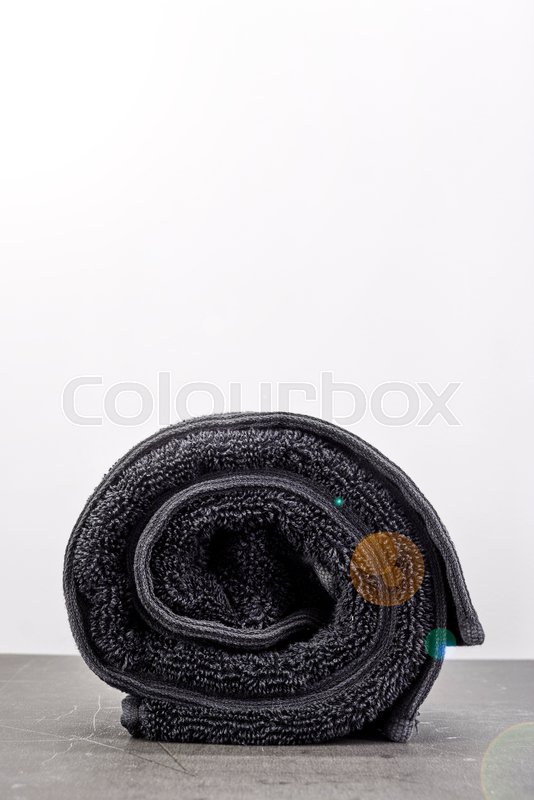 A studio photo of a black bathing towel | Stock image | Colourbox