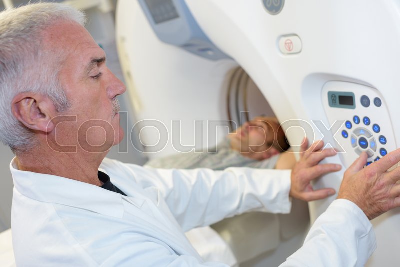 Doctor programming mri scanner | Stock image | Colourbox