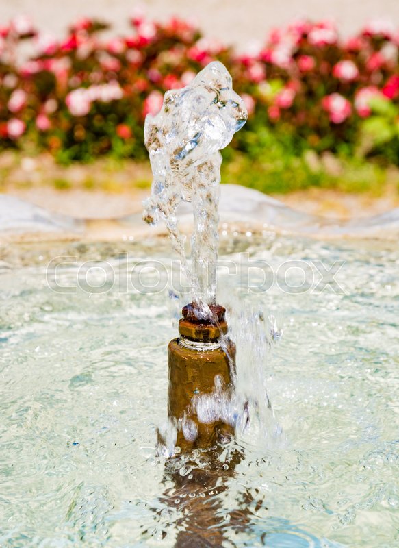 Closeup of water flwoing out of a ... | Stock image | Colourbox