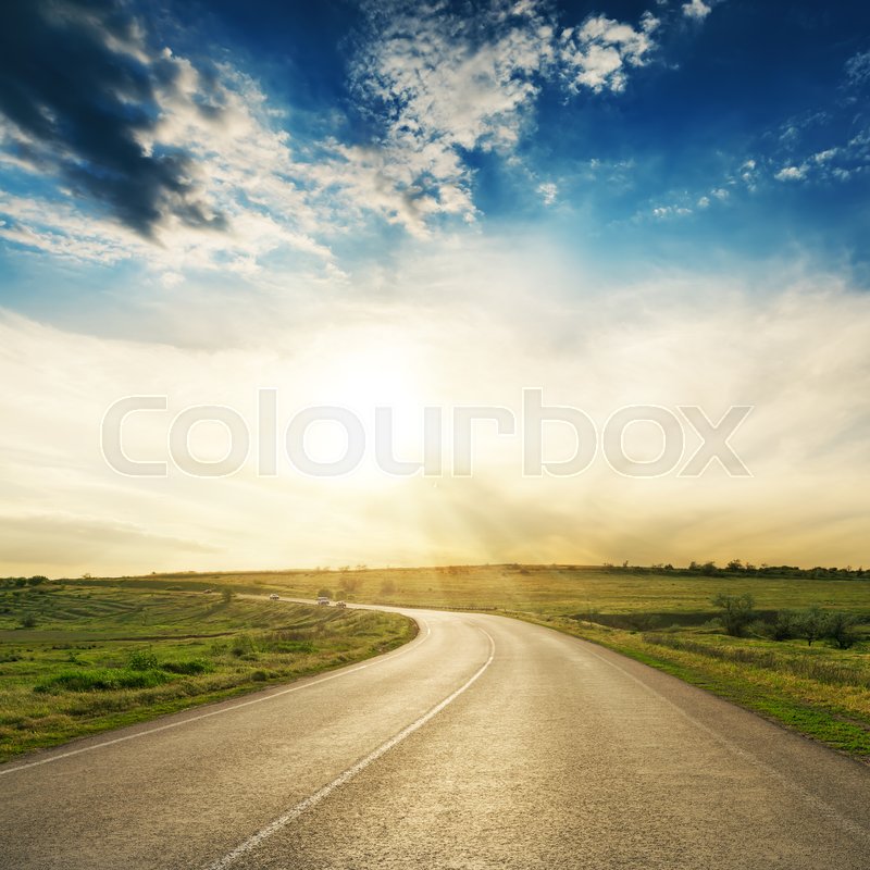 Road to horizon in sunset. Low clouds ... | Stock image | Colourbox