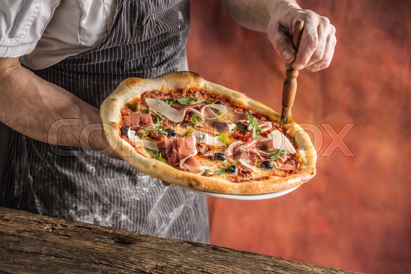Pizza and Chef. Chef in the restaurant ... | Stock image | Colourbox