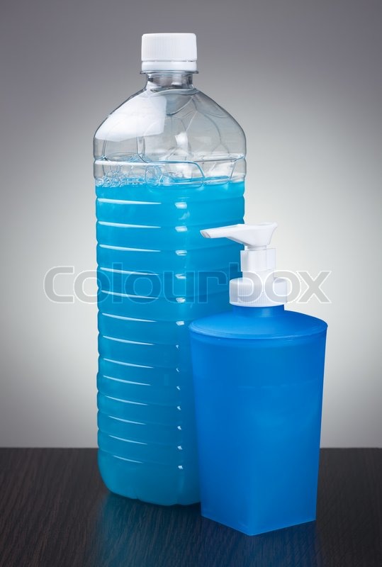 Blue liquid soap on the table over grey ... | Stock image | Colourbox