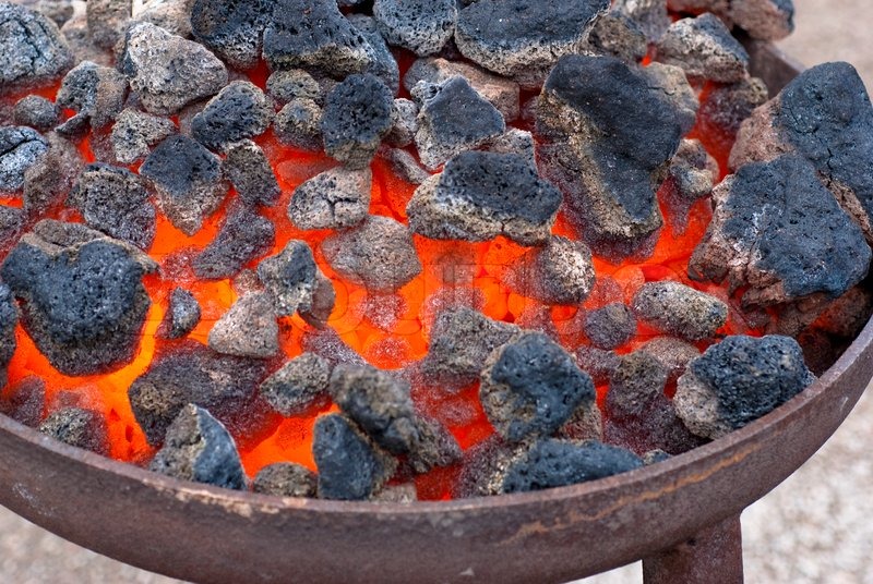 Burning hot coals close-up and outdoors | Stock image | Colourbox
