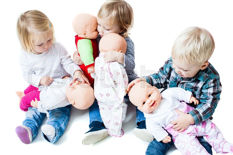 Kids playing with dolls. The boy and ... | Stock image | Colourbox