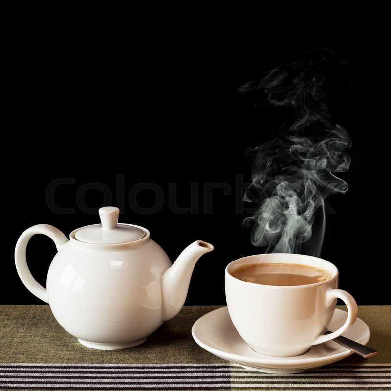 Tea concept - a hot, steaming cup of ... | Stock image | Colourbox