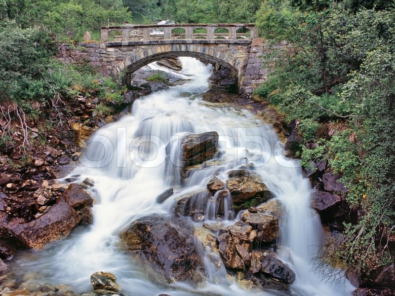 Old stone bridge over water stream, Norway | Stock Photo | Colourbox