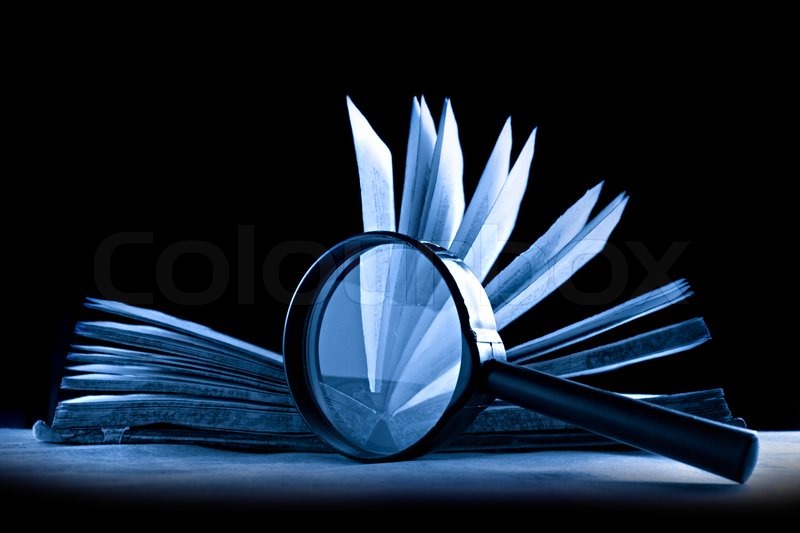 Magnifying glass and a book in blue | Stock Photo | Colourbox