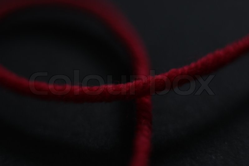 Red thread close up macro - on black ... | Stock image | Colourbox