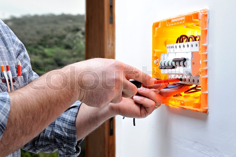 Electrician technician at work on a ... | Stock image | Colourbox