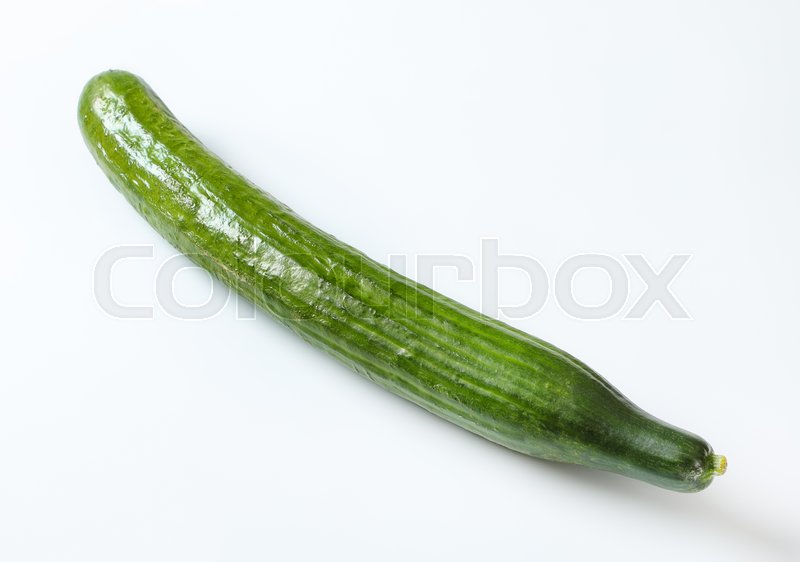 Single long cucumber on white ... | Stock image | Colourbox