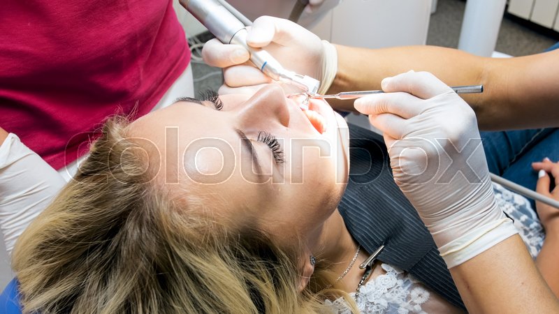 Closeup image of dentist removing teeth ... | Stock image | Colourbox