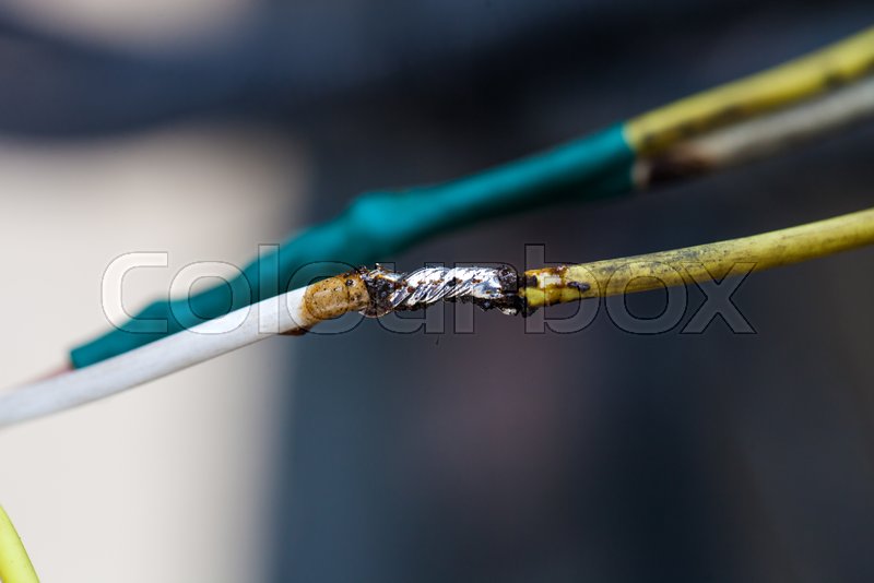Closeup of exposed live electrical wire ... | Stock image | Colourbox