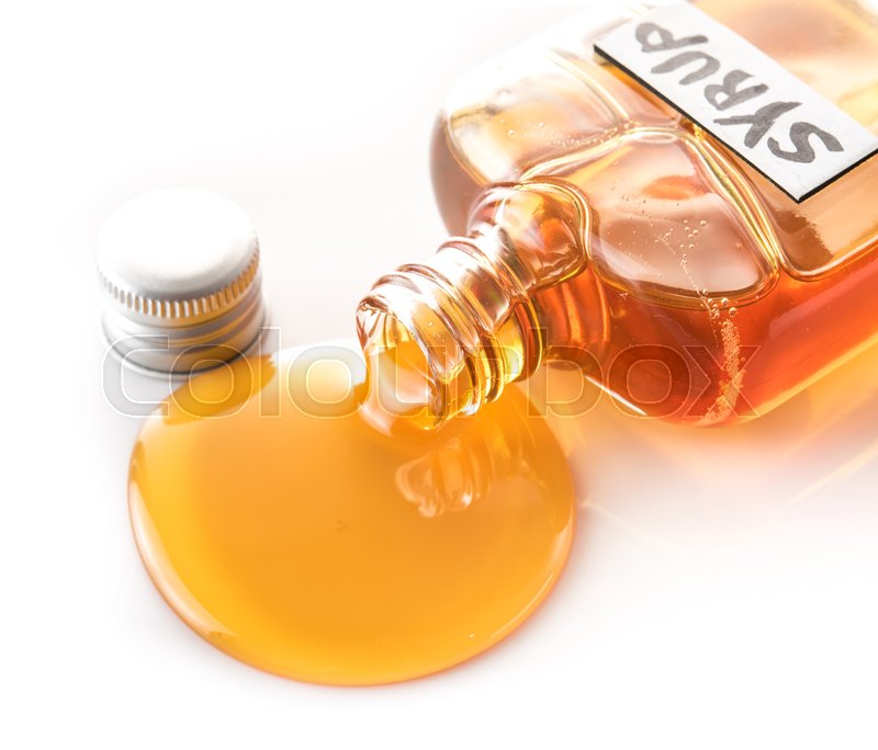 Maple syrup bottle pouring on white ... | Stock image | Colourbox