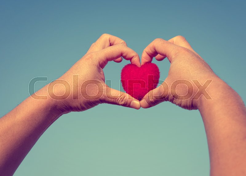 Man hands forming a heart showing a ... | Stock image | Colourbox