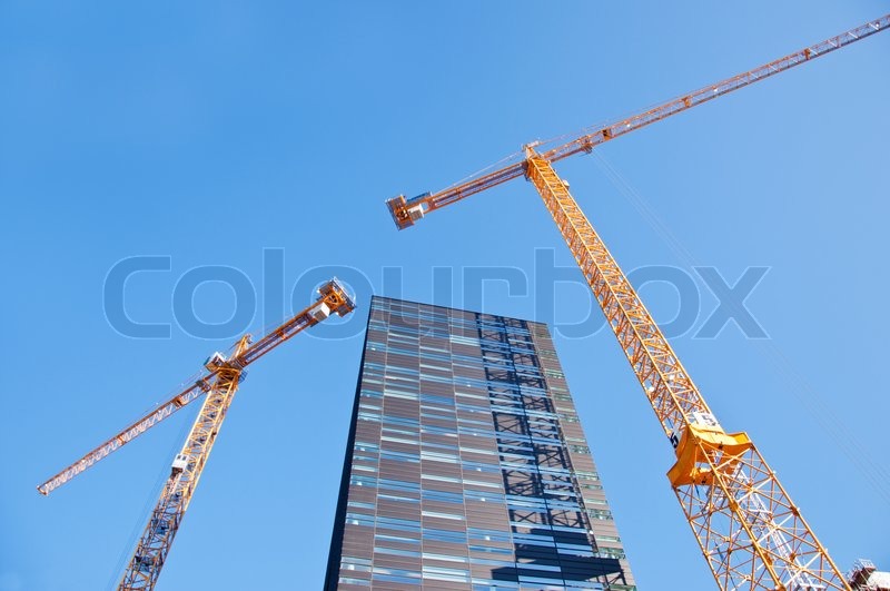 Skyscraper with tower cranes on sky ... | Stock Photo | Colourbox