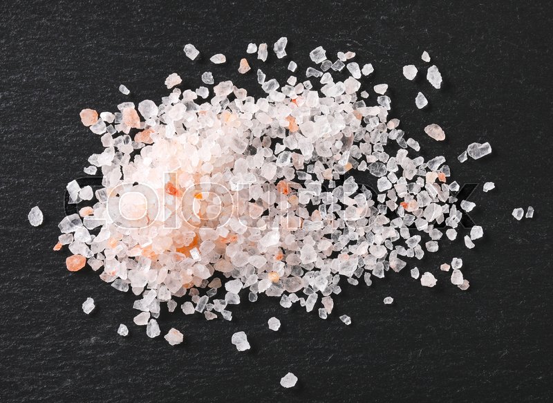 Coarse grain Himalayan salt on black ... | Stock image | Colourbox