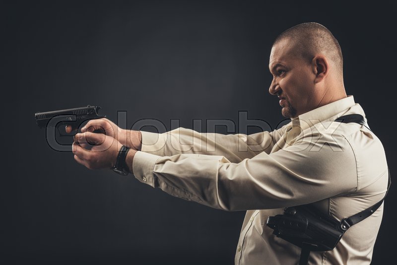 Man Pointing Gun To The Side