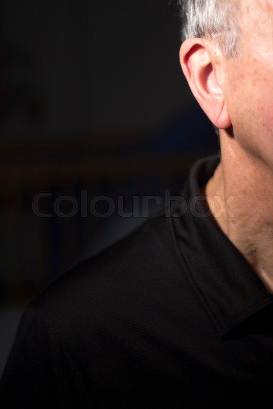 Deaf senior citizen man wearing modern ... | Stock image | Colourbox