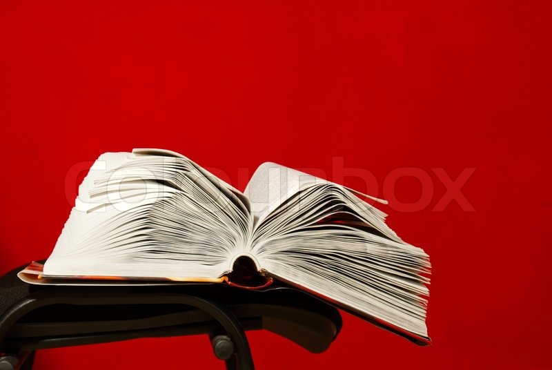 Open book laying on the chair against ... | Stock image | Colourbox
