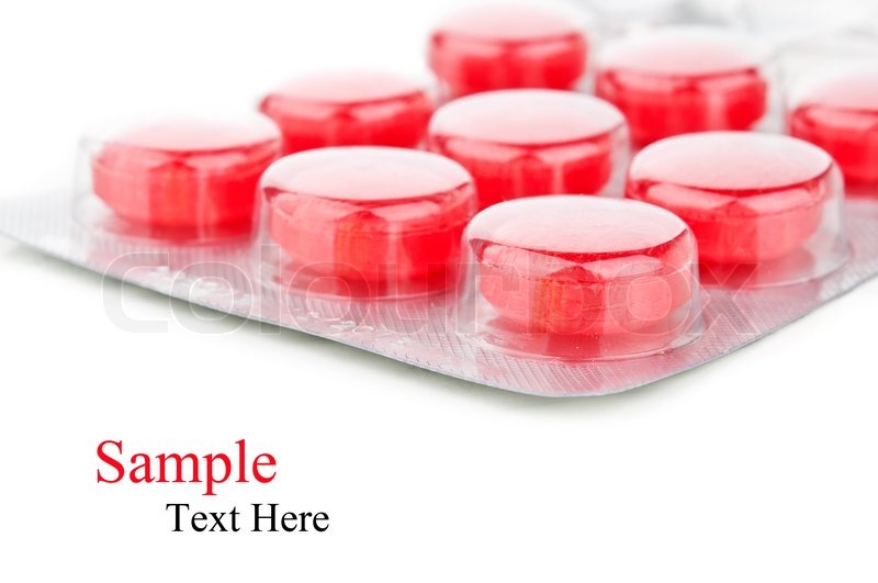 Closeup af røde piller isoleret på en ... | Stock foto | Colourbox
