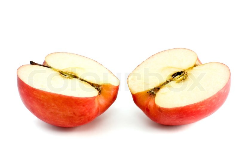 Two red apple halves isolated on the ... | Stock image | Colourbox